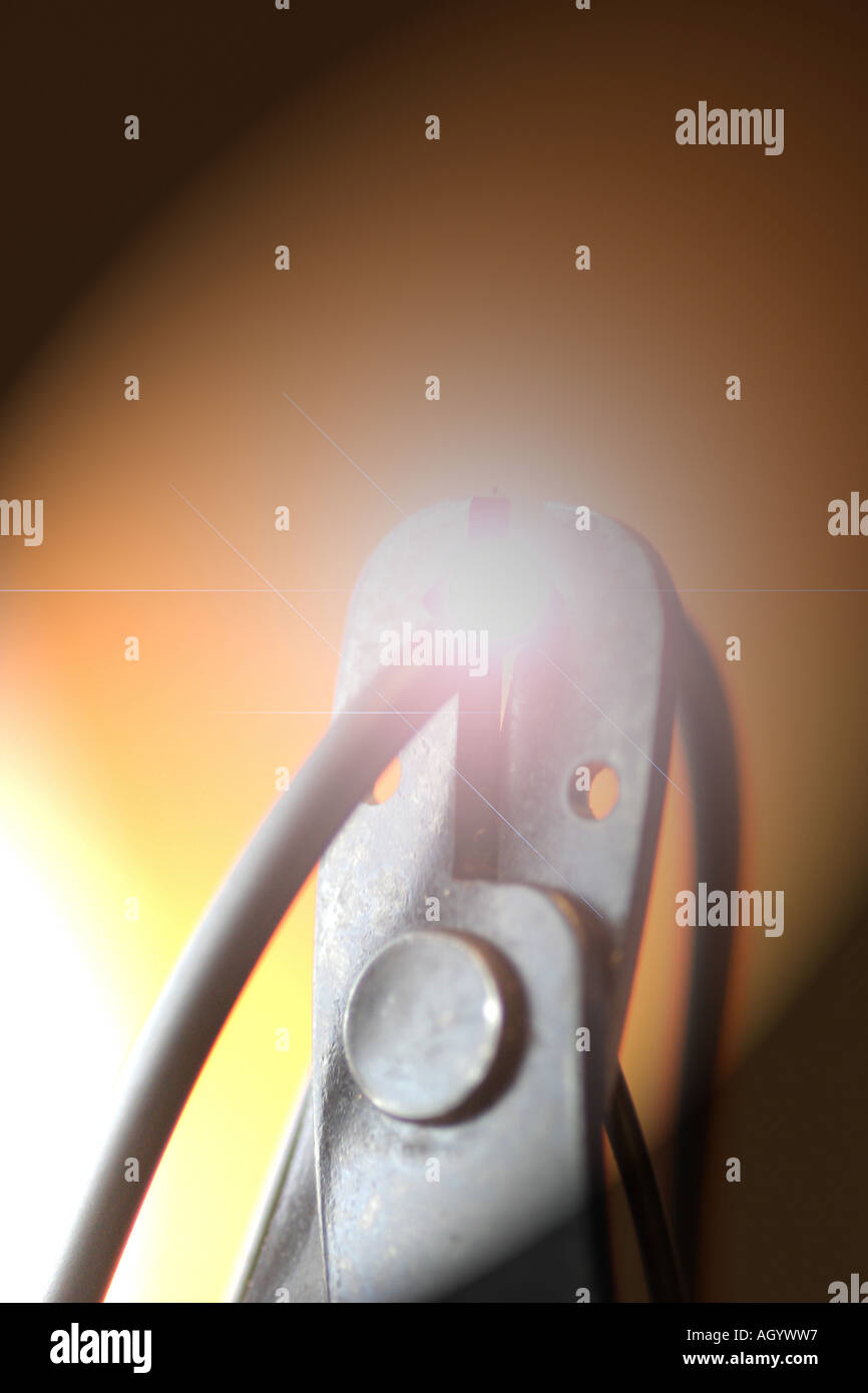 A stock photograph of a wire being cut by wire cutters Stock Photo - Alamy