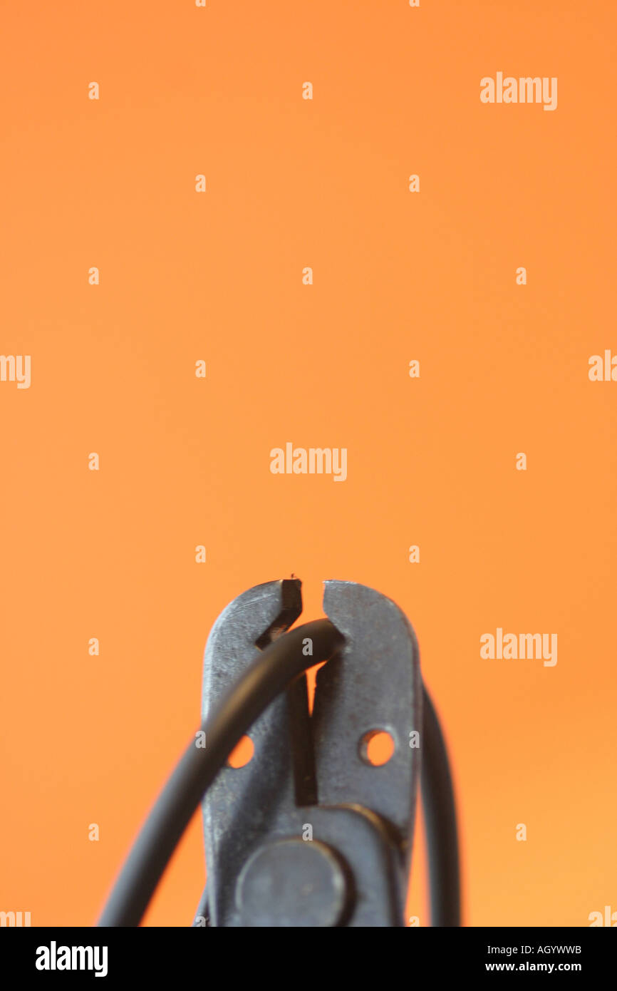 A stock photograph of a wire being cut by wire cutters Stock Photo - Alamy