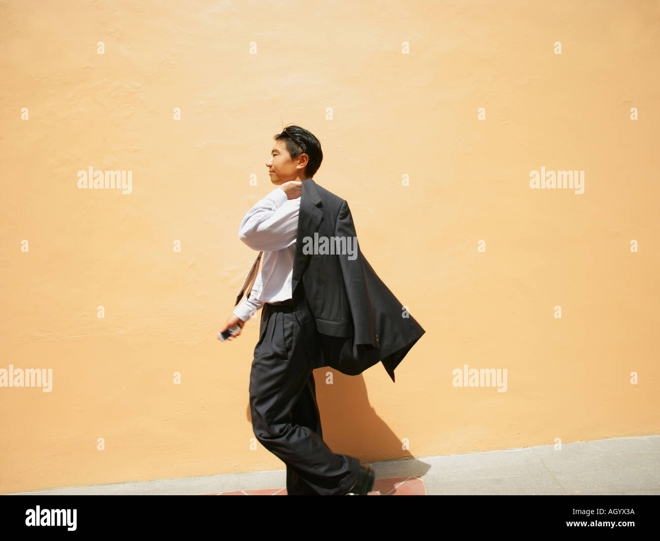 Side profile of a businessman walking Stock Photo - Alamy