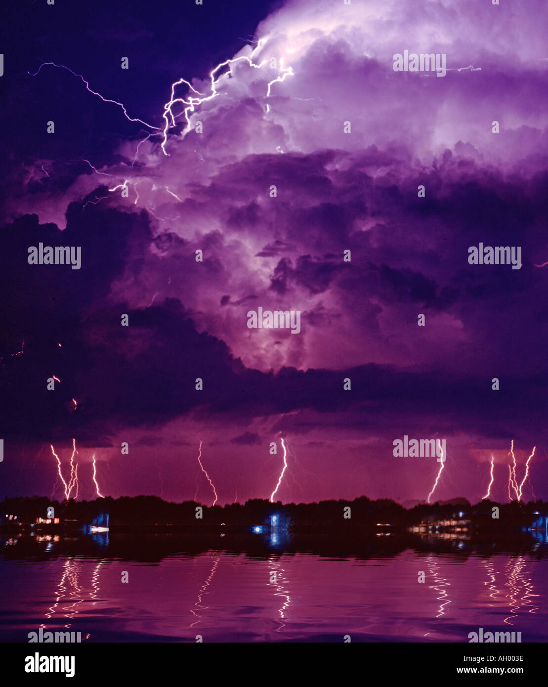 multiple lightning strikes reflected in water Stock Photo - Alamy