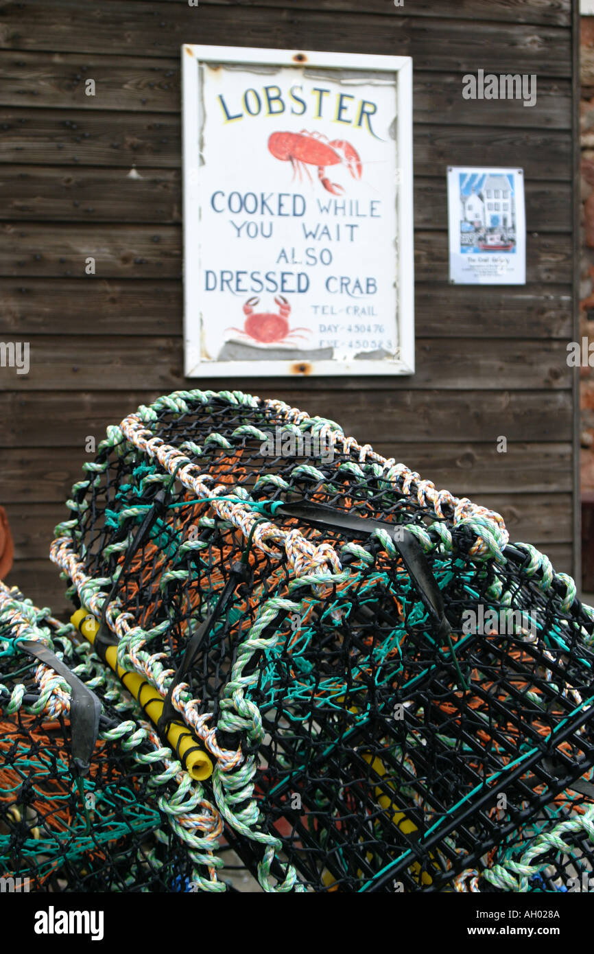 Lobster traps and poster at Crail fishing port on the Neuk of Fife ...