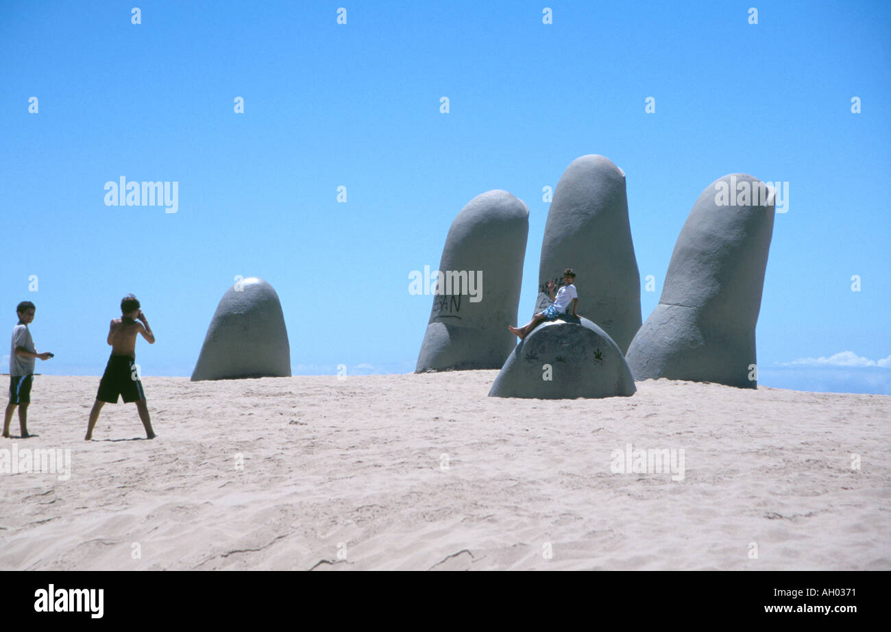 Hand in the Sand at Punta del Este Uruguay fingers sticking out of the ...