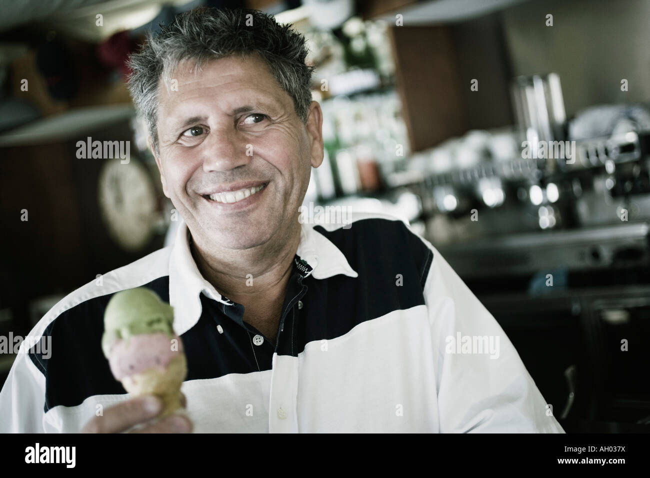 Close-up of a senior man holding an ice-cream Stock Photo - Alamy