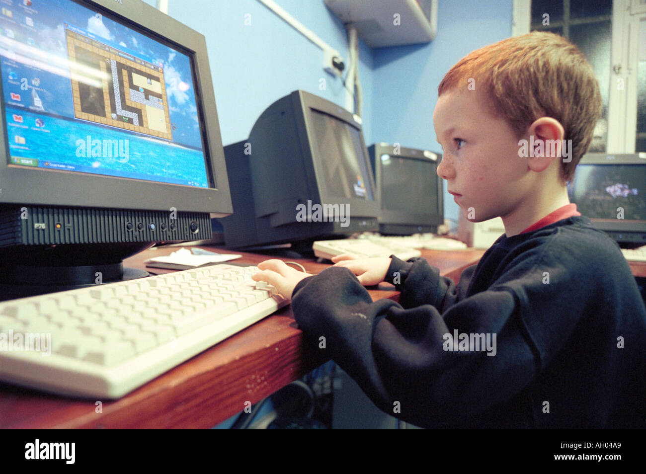 Boy playing computer game London England Britain UK Stock Photo - Alamy