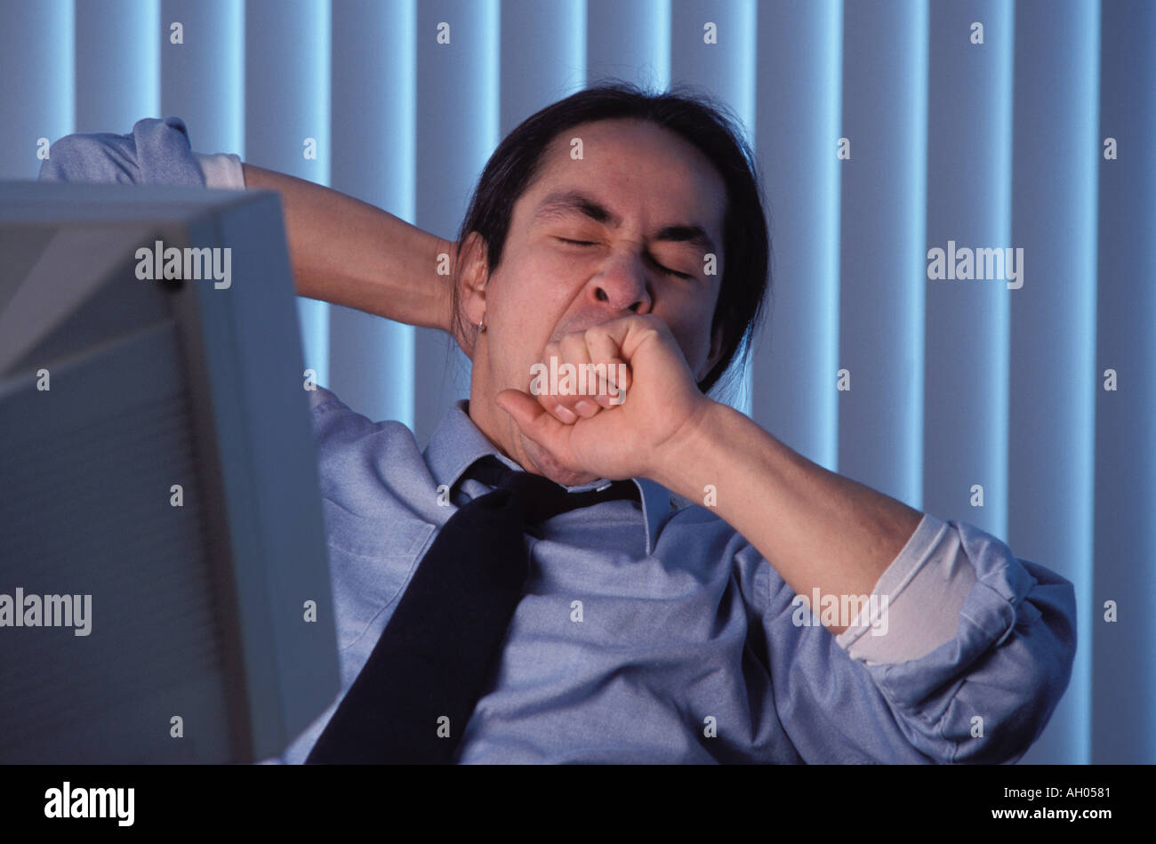 Sleepy Man Working Late at Office Stock Photo - Alamy