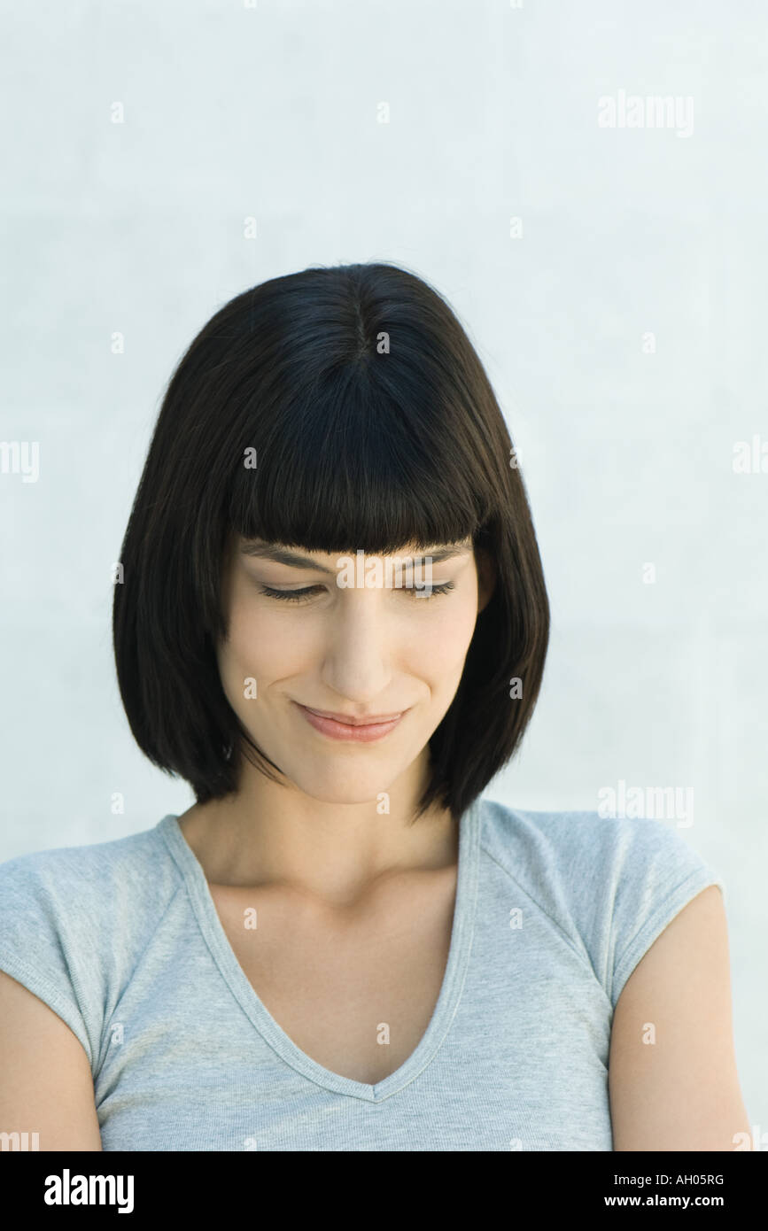Young woman smirking, portrait Stock Photo - Alamy