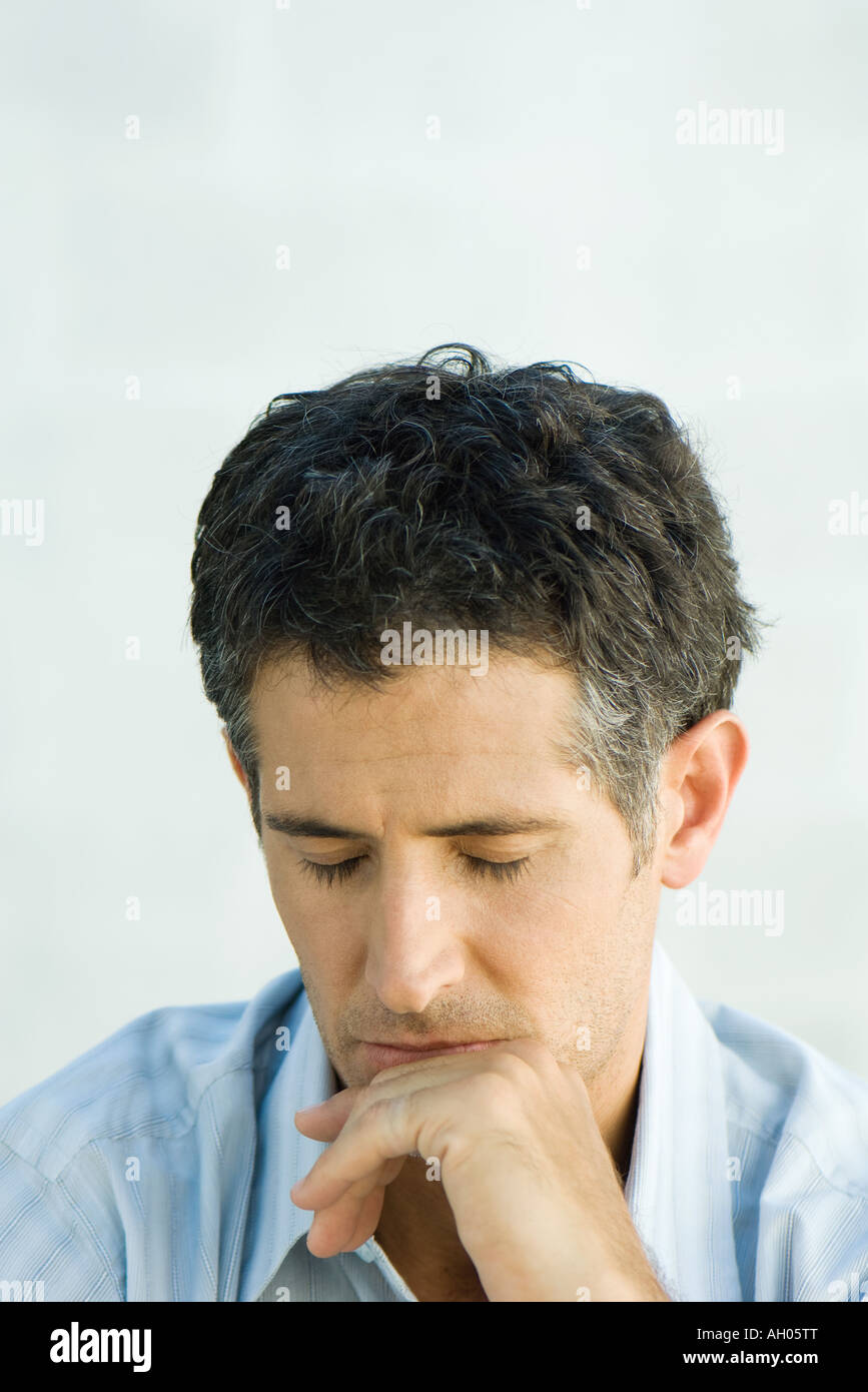 Man with hand on chin, eyes closed, portrait Stock Photo - Alamy