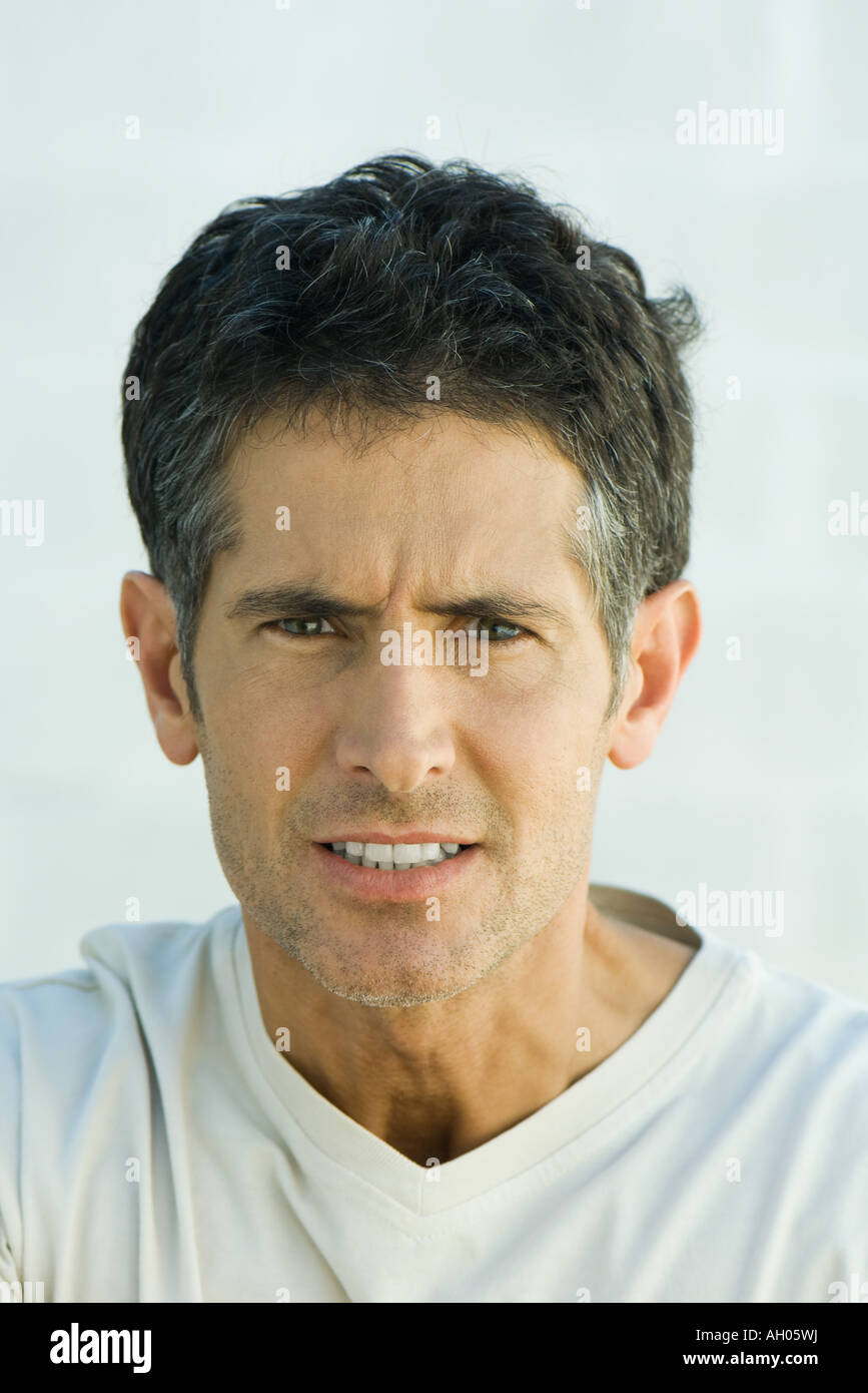 Man snarling at camera, portrait Stock Photo - Alamy