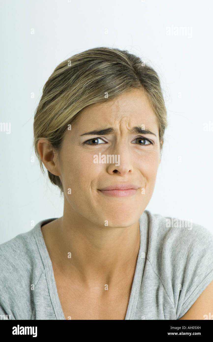 Young woman making face, portrait Stock Photo - Alamy