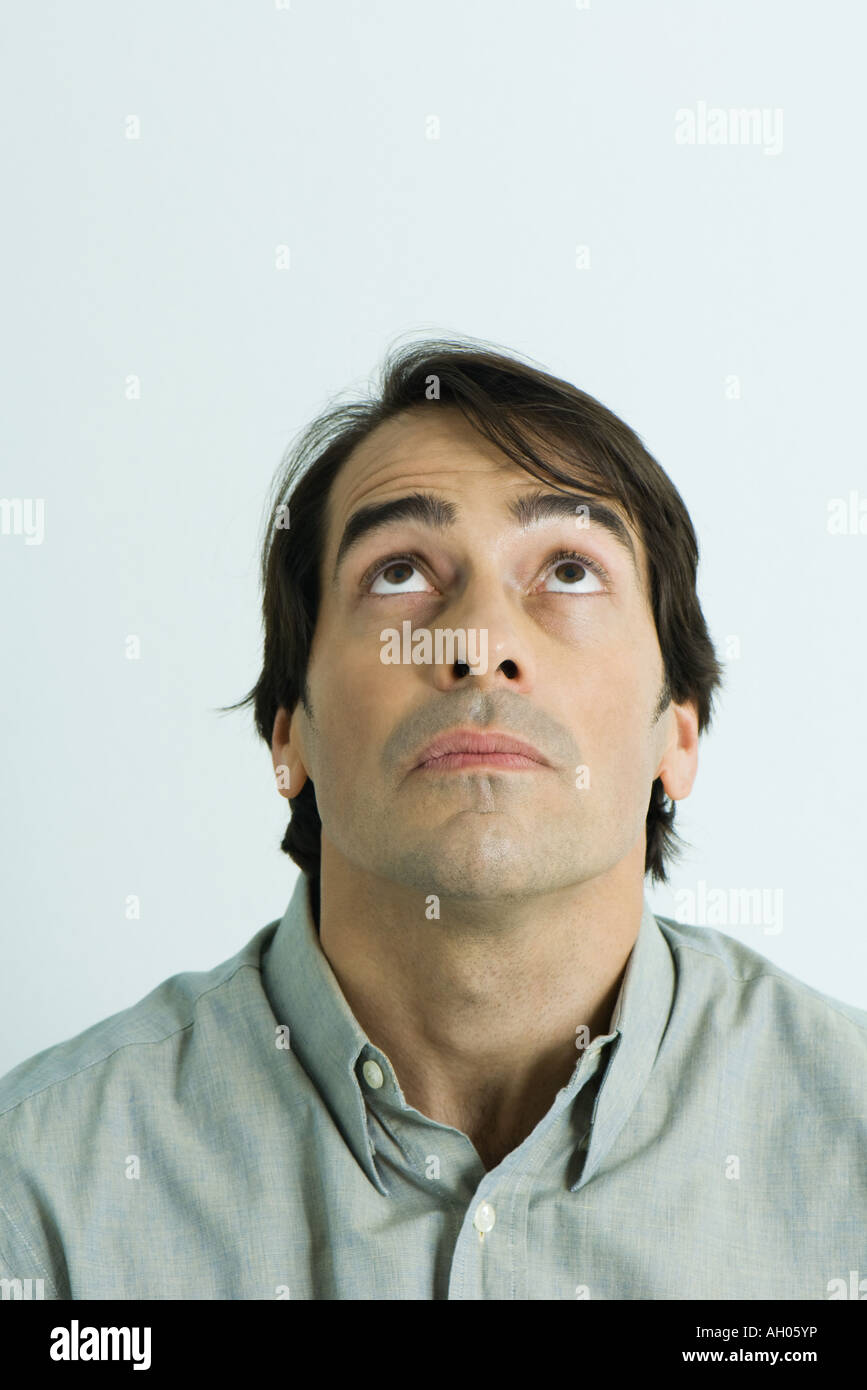 Man looking up, portrait Stock Photo - Alamy