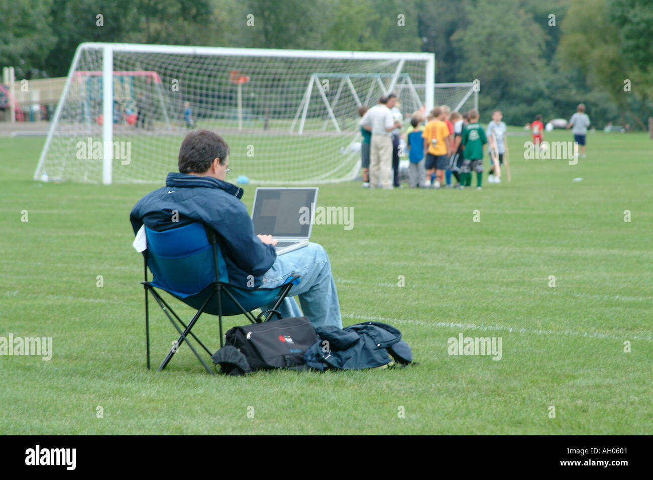 Workaholic Soccer Football Dad Using Laptop Computer While Son Plays ...