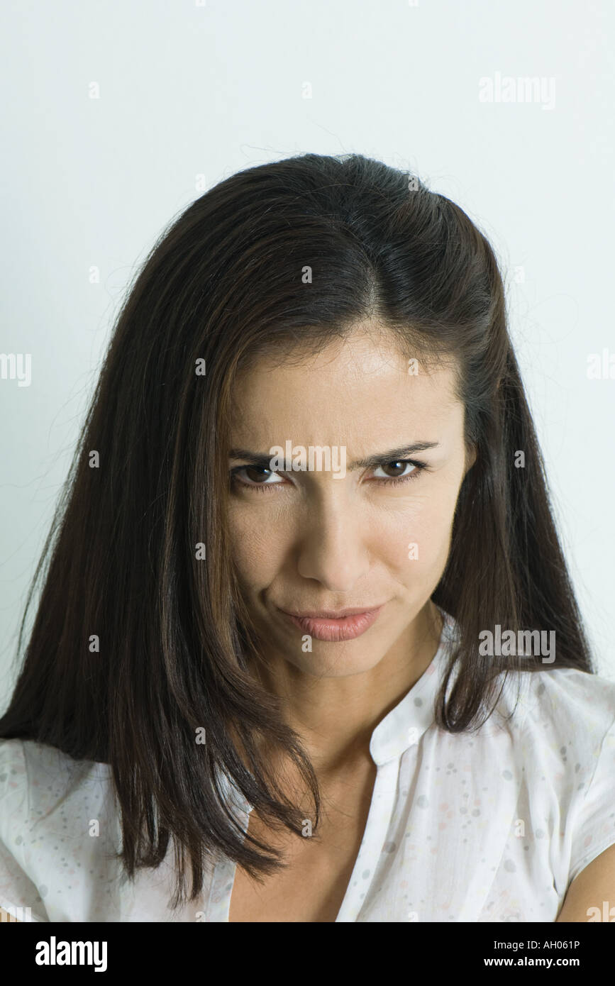 Woman pouting, looking at camera, portrait Stock Photo - Alamy