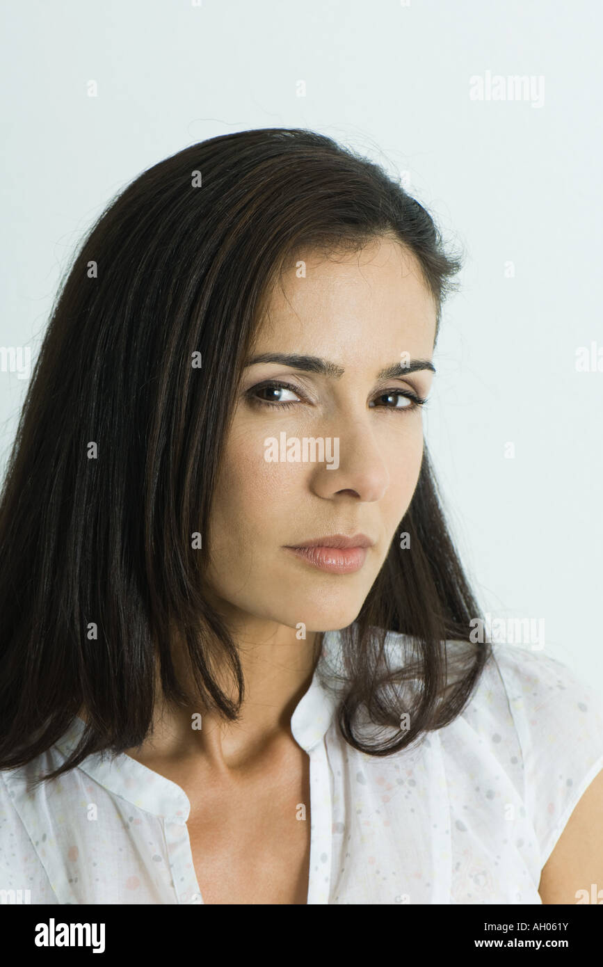 Woman giving sideways glance to camera, portrait Stock Photo - Alamy