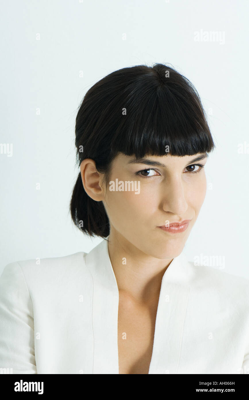 Woman smirking at camera, portrait Stock Photo - Alamy