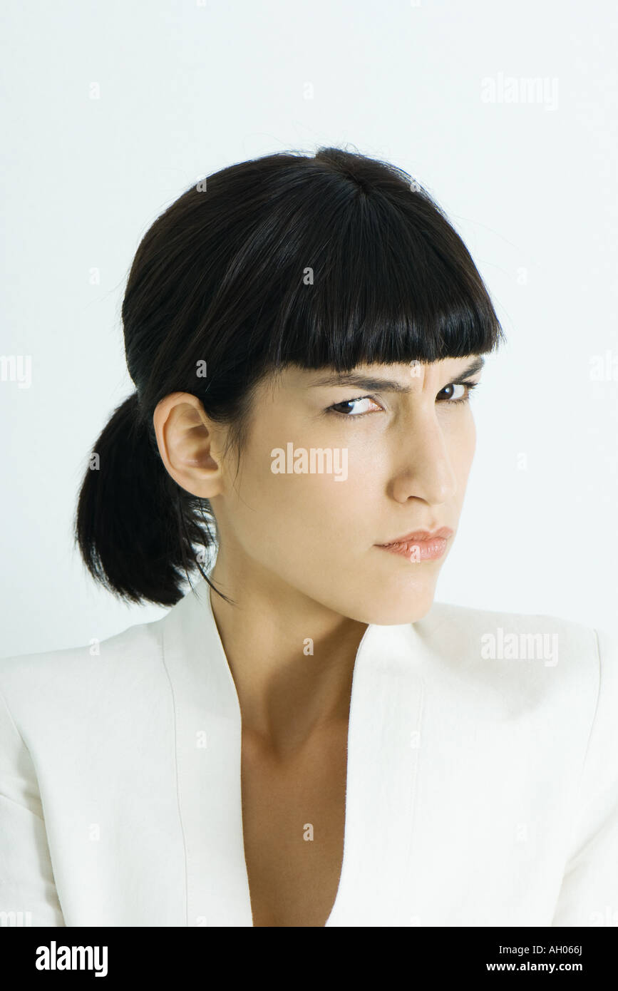 Woman frowning at camera, portrait Stock Photo - Alamy