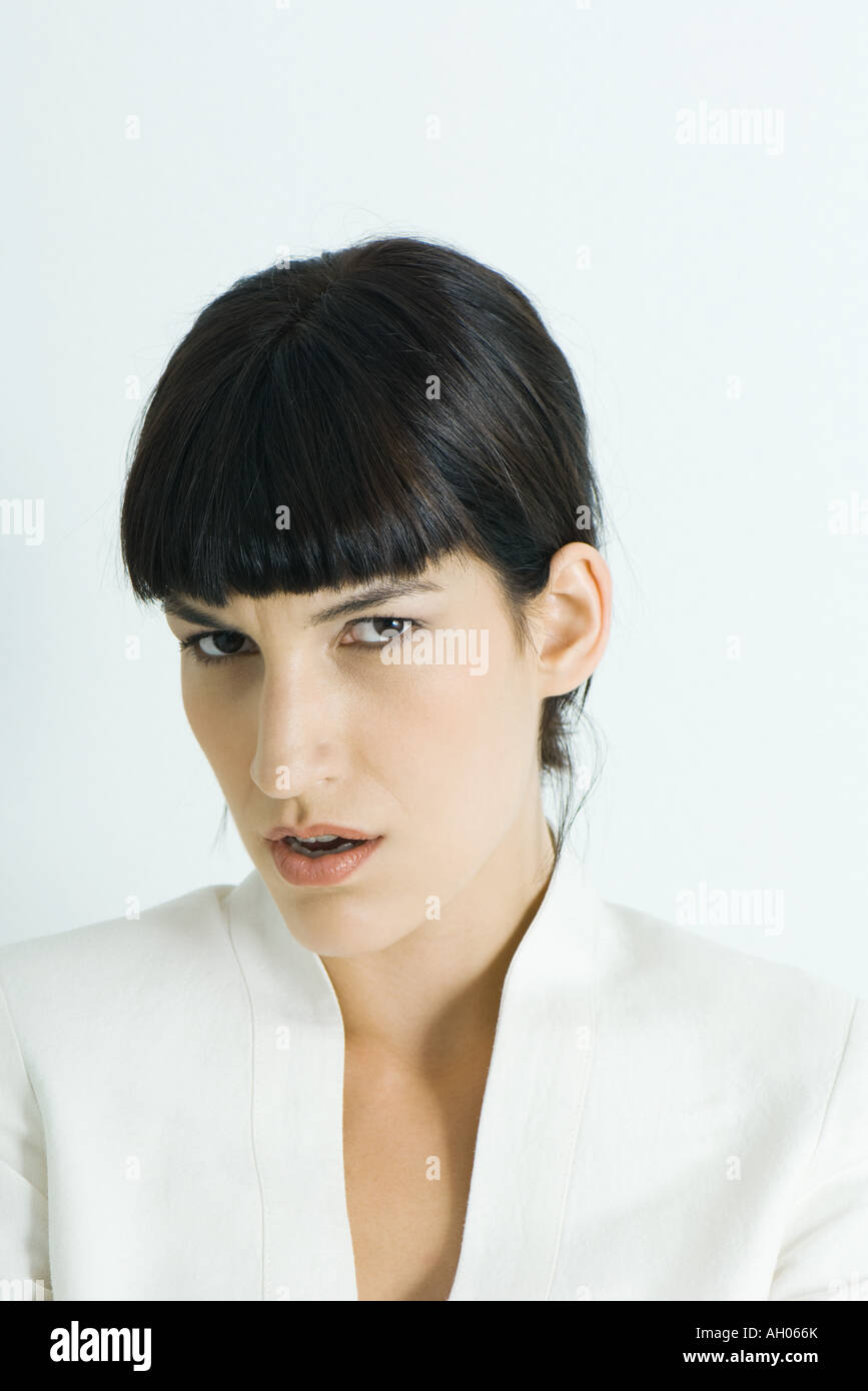 Woman frowning at camera, portrait Stock Photo - Alamy