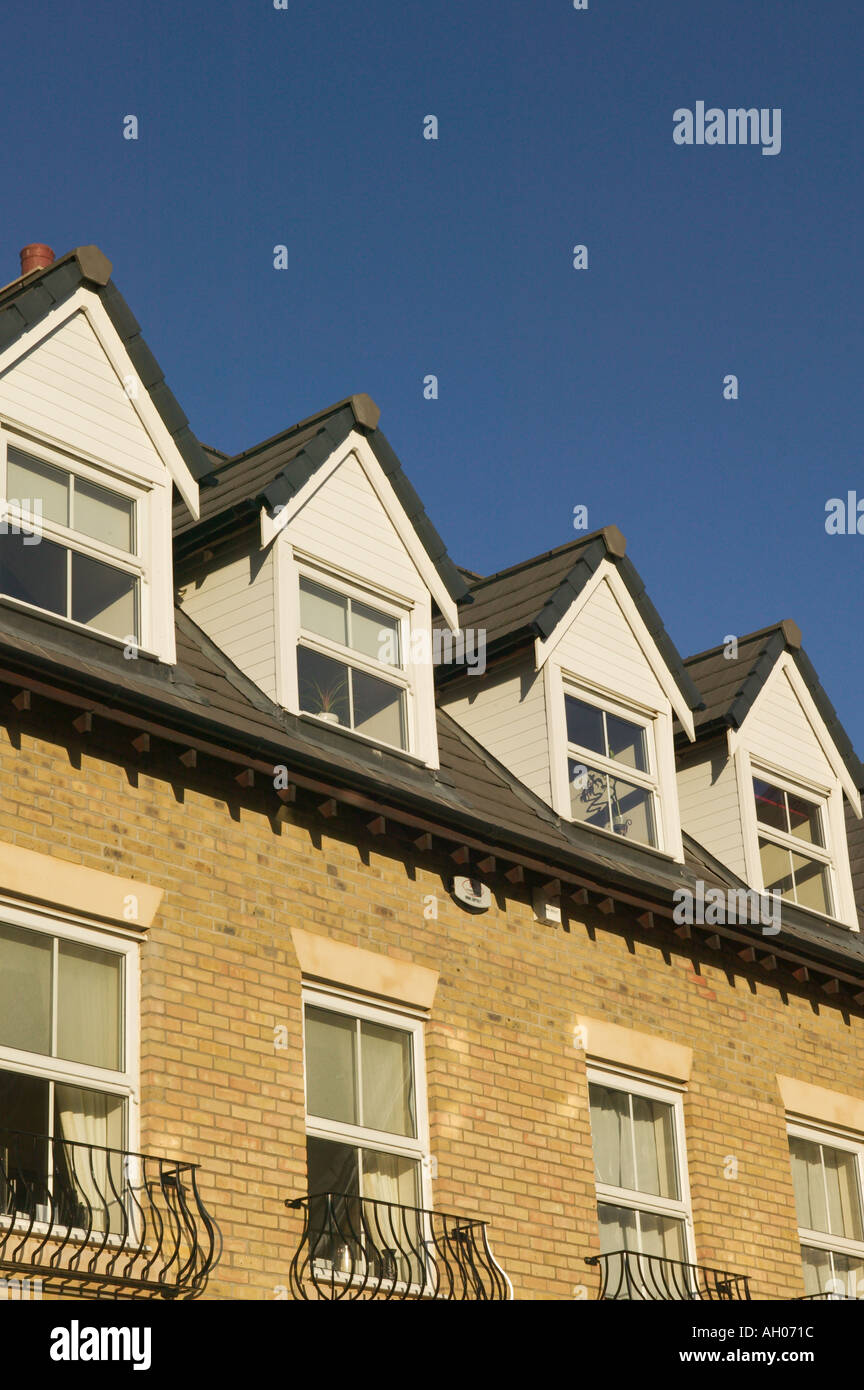 Windows and Dormer Windows on Block of Flats Apartments Stock Photo - Alamy