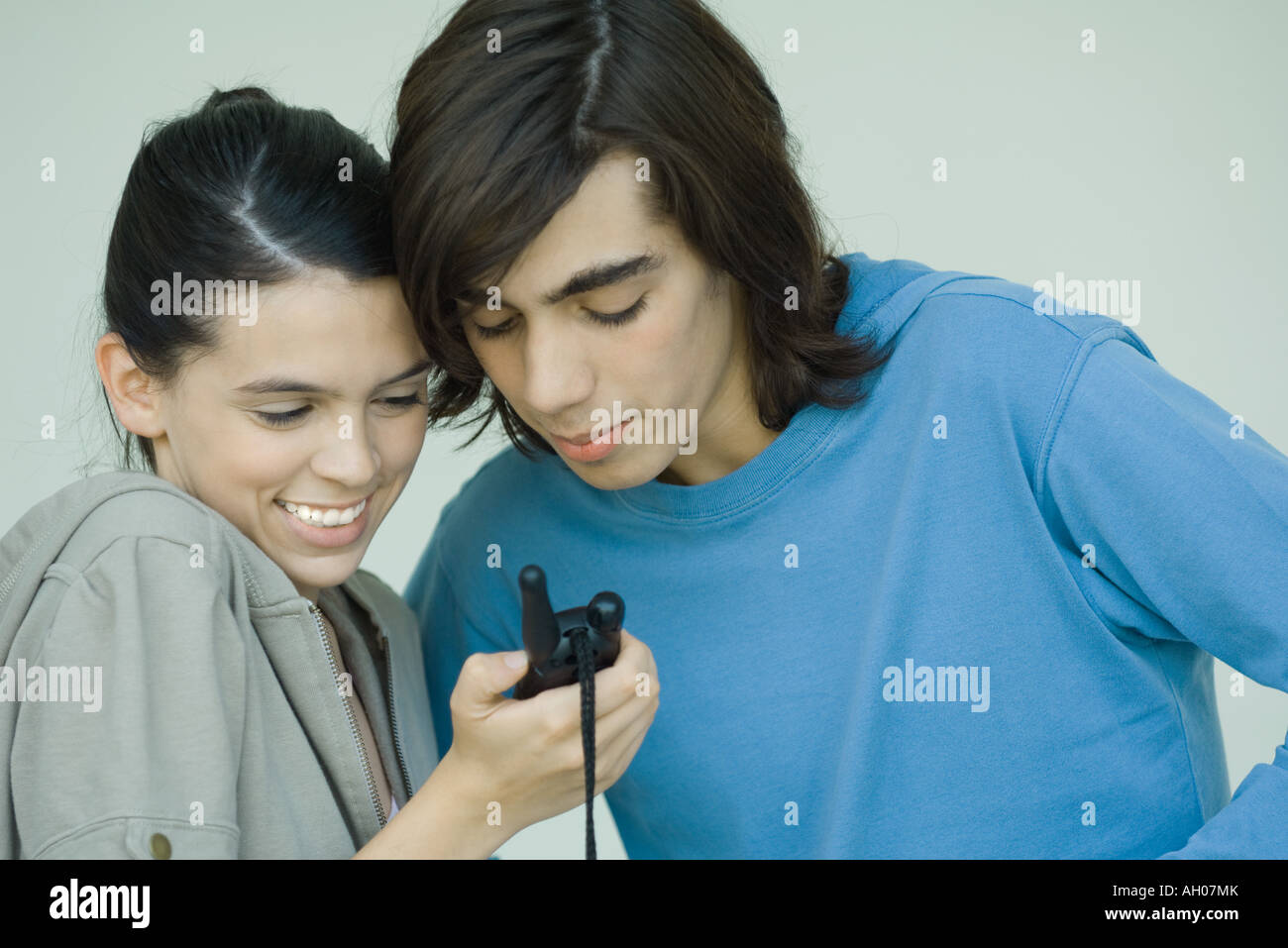 Teenager male dark hair phones hi-res stock photography and images - Alamy