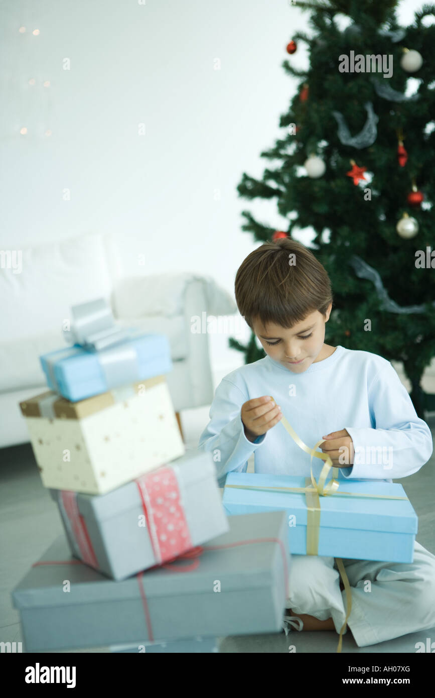Boy opening present indian hi-res stock photography and images - Alamy