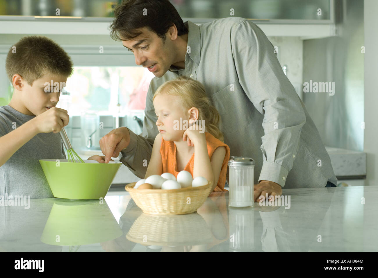 Father cooking with son and daughter Stock Photo - Alamy