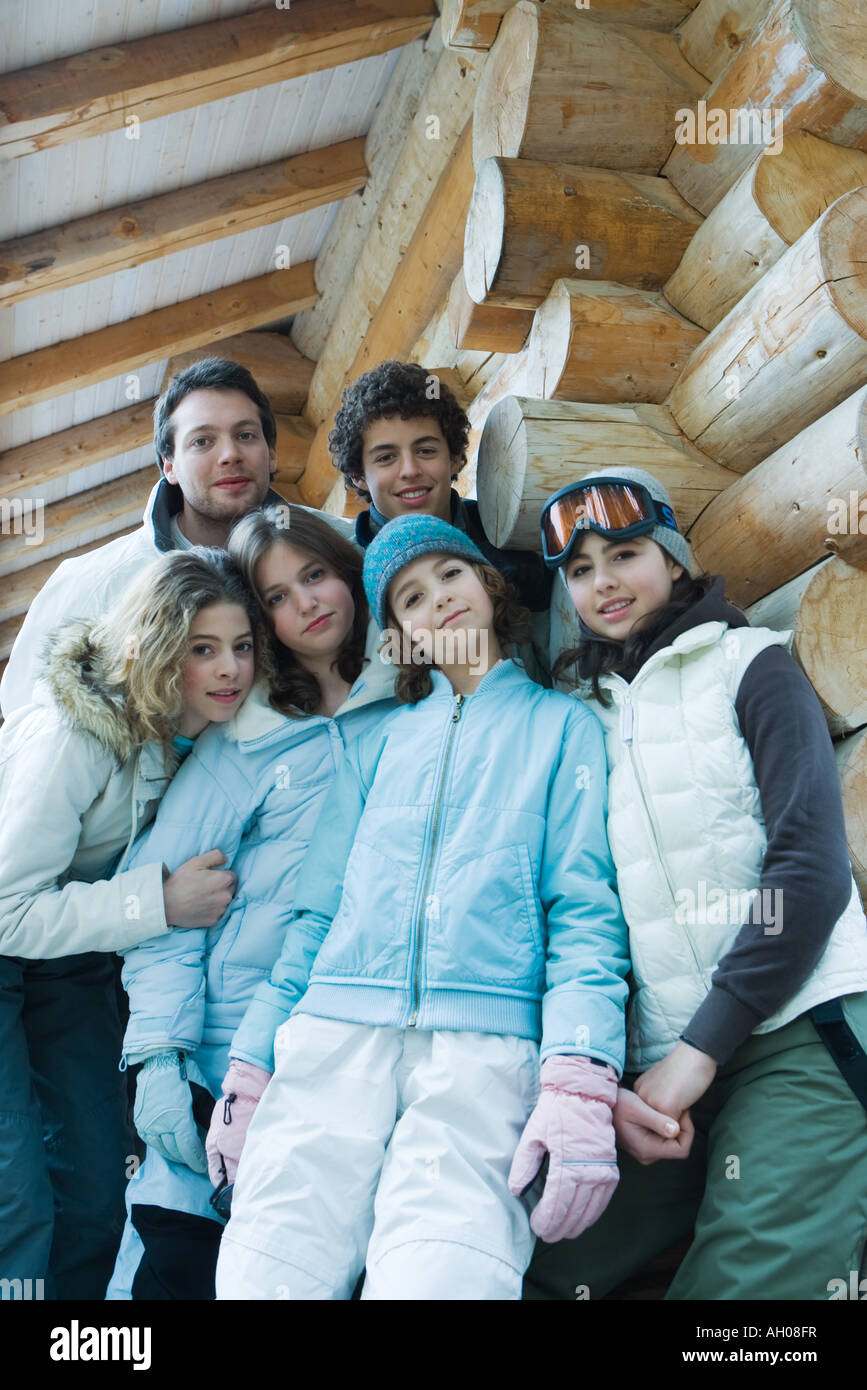 Group portrait in winter clothes, three quarter length, low angle view ...