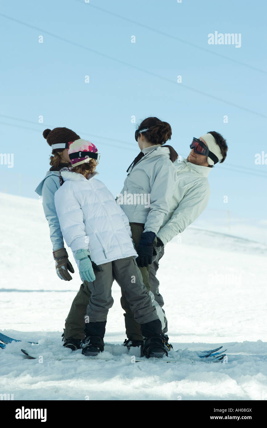 Group having fun in snow, full length Stock Photo - Alamy