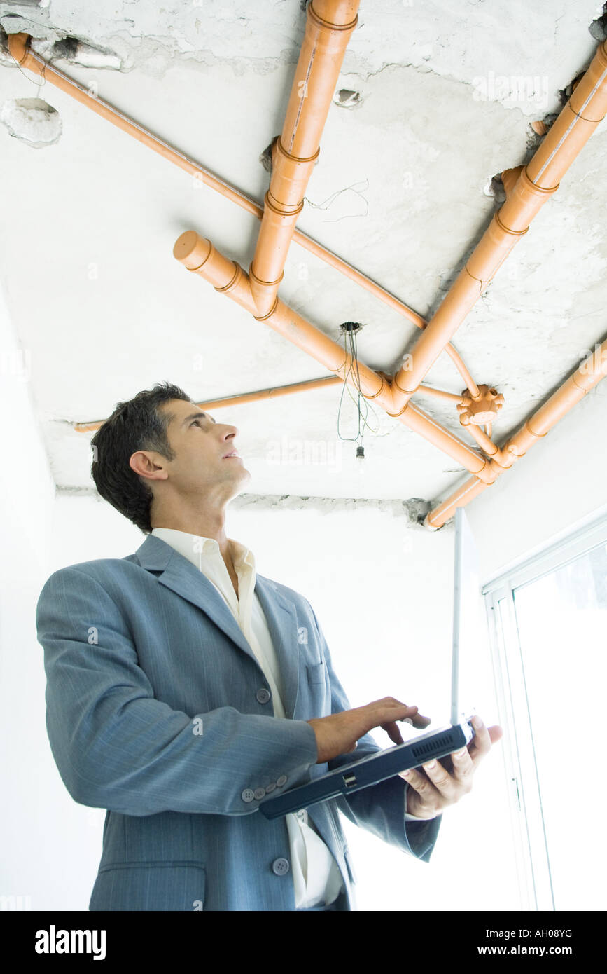 Inspecting laptops hi-res stock photography and images - Alamy
