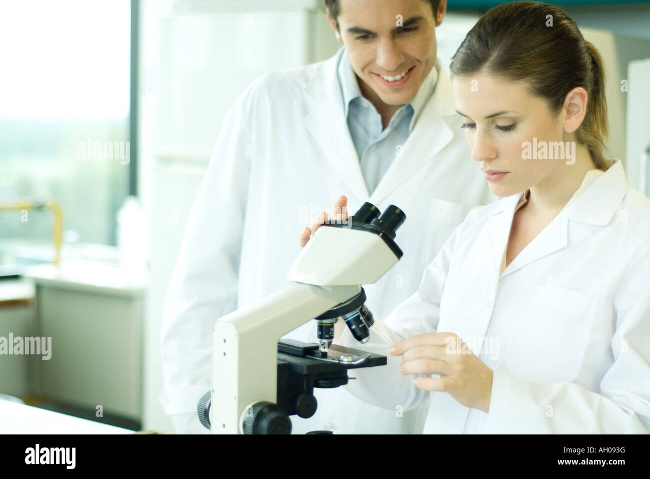 Persons using microscope in lab hi-res stock photography and images - Alamy