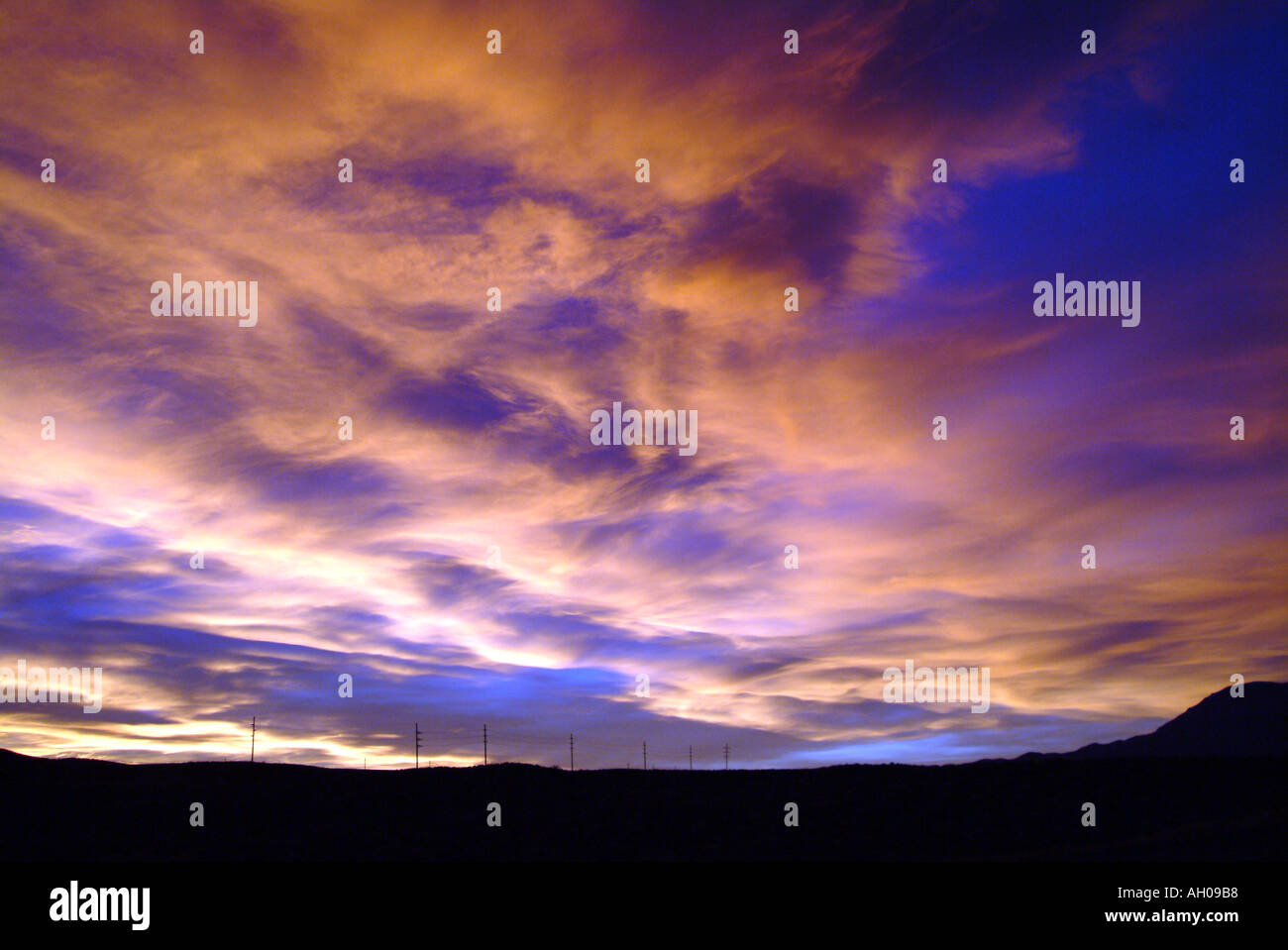 Flamming desert sunset Stock Photo - Alamy