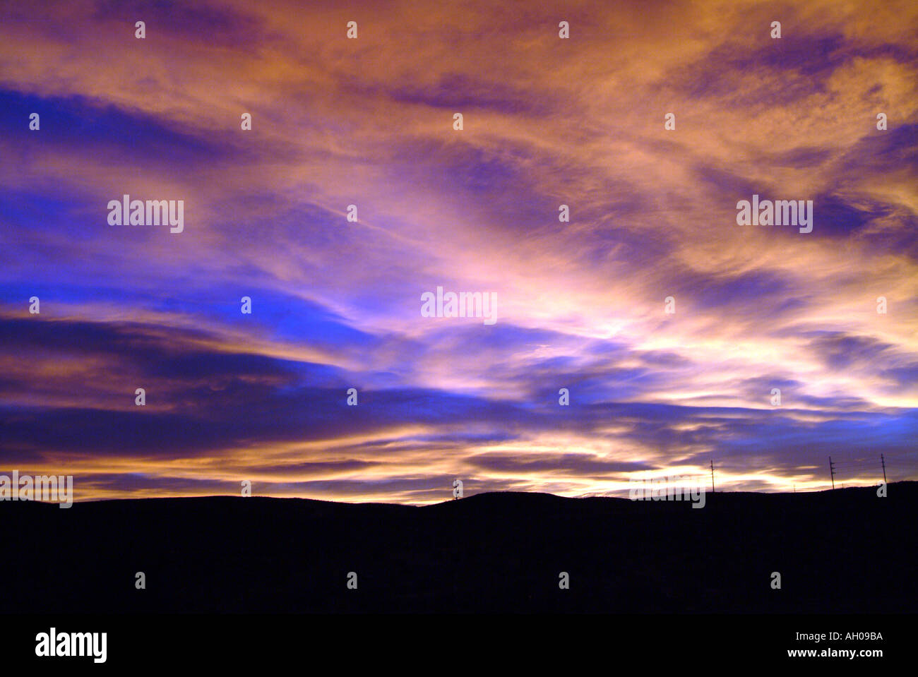 Flamming desert sunset Stock Photo - Alamy