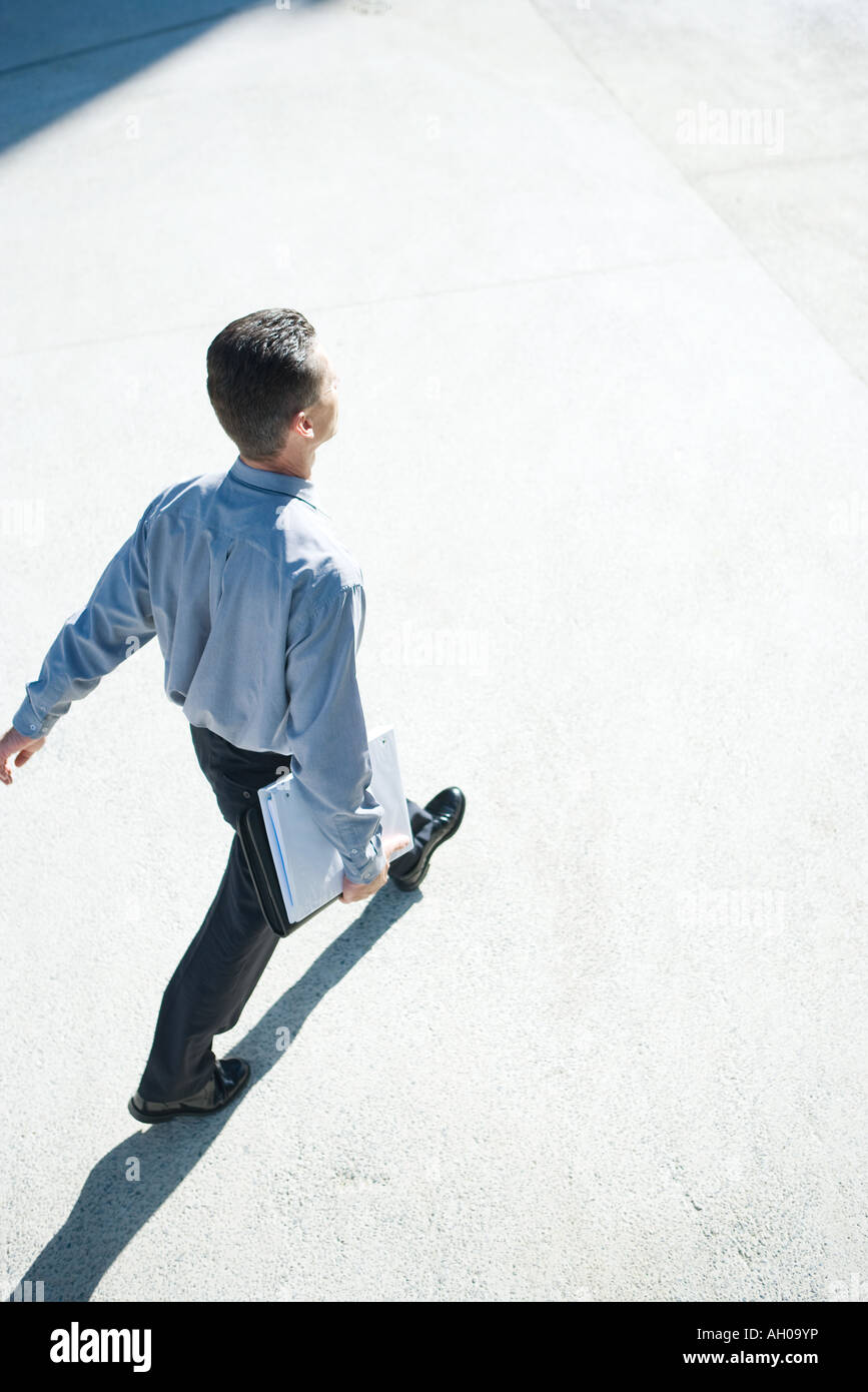 Businessman walking outdoors, full length, high angle view Stock Photo ...