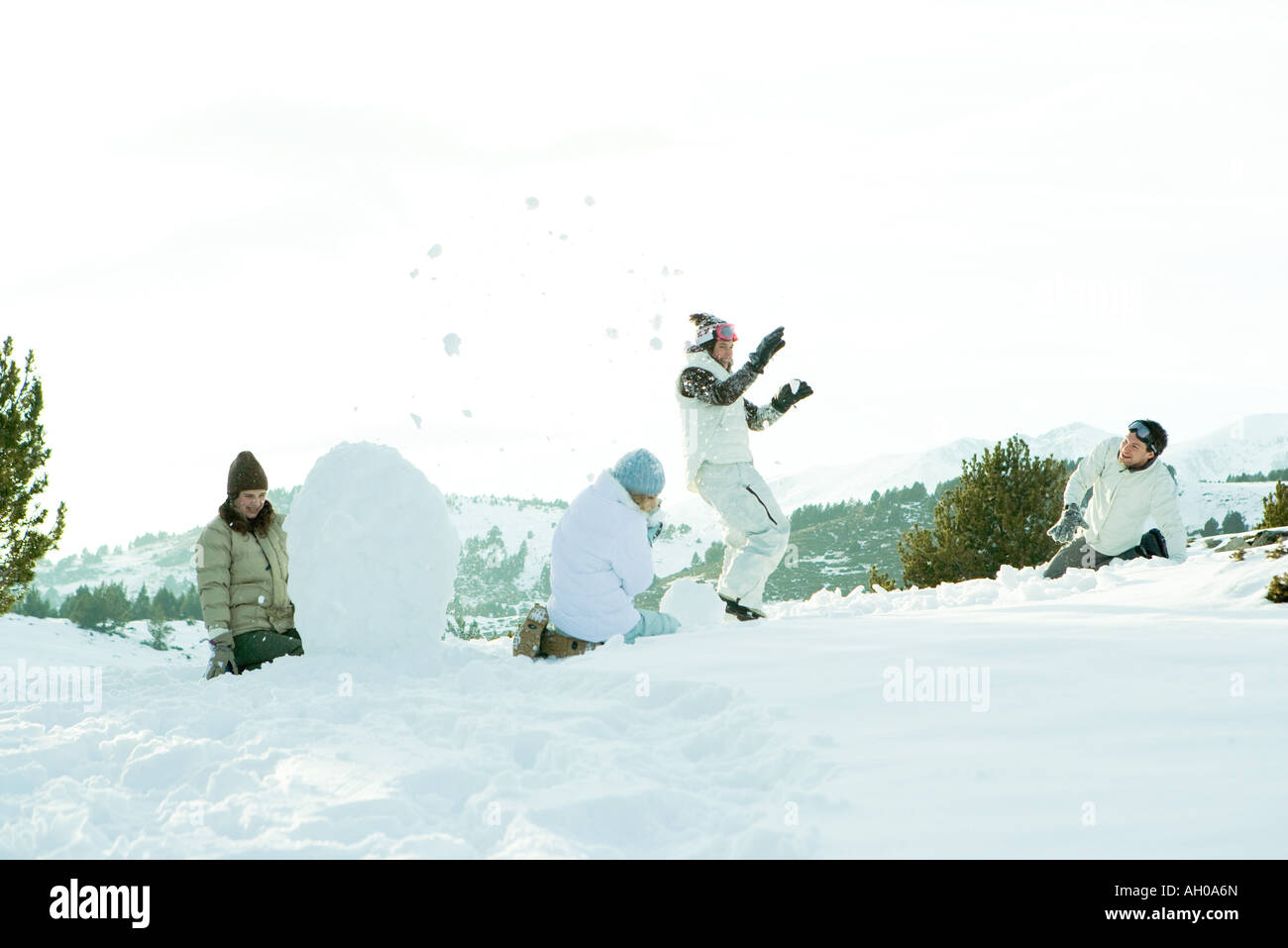 Children throwing snowballs hi-res stock photography and images - Alamy