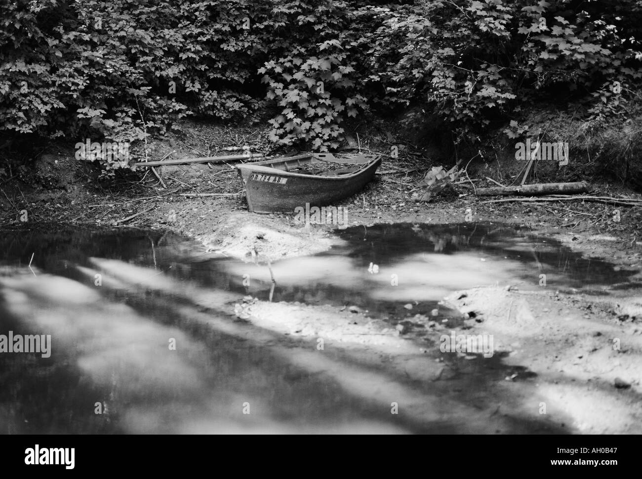 Old boat by the water Stock Photo - Alamy