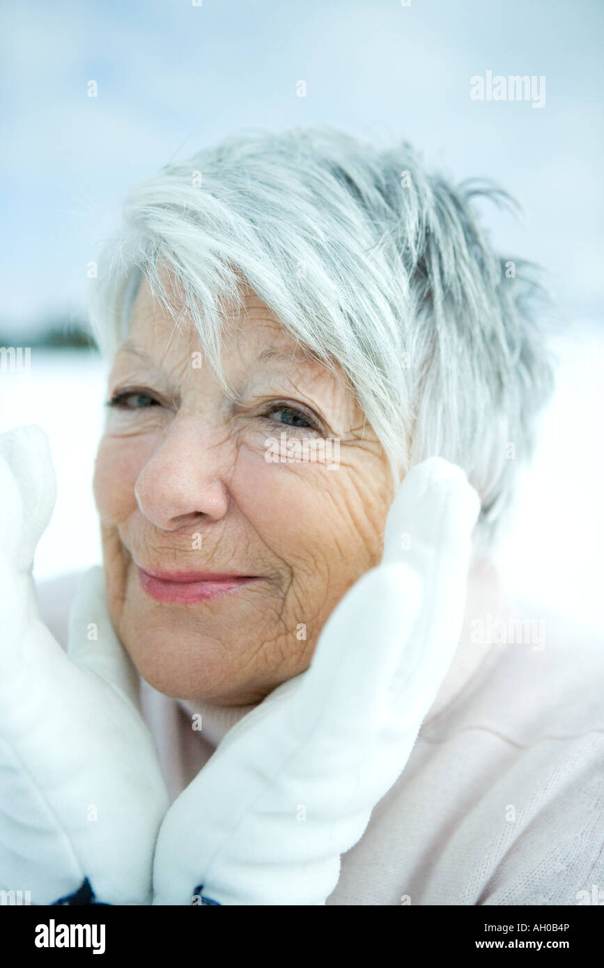 Portrait of woman looking around corner hi-res stock photography and ...