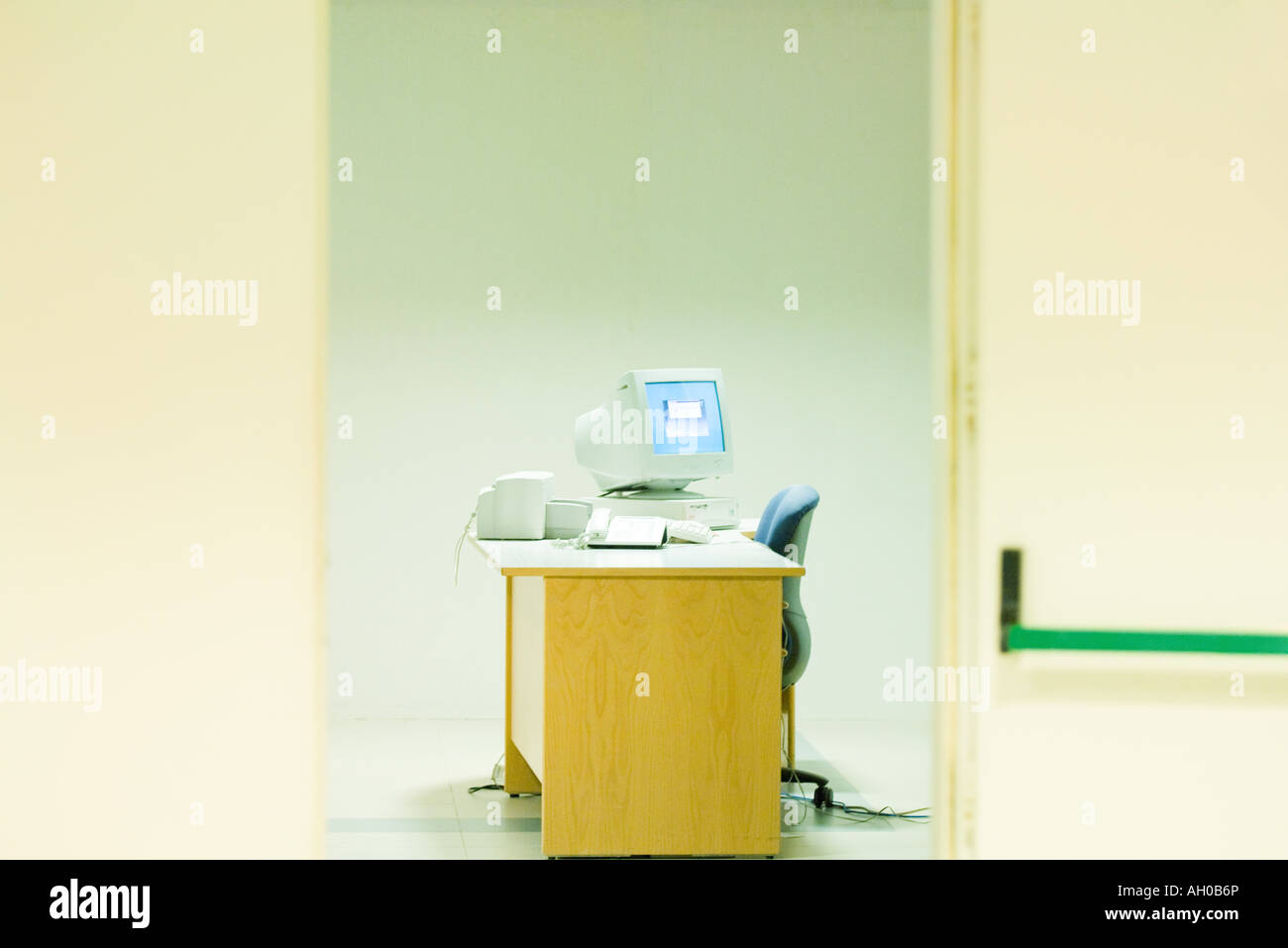 Office with desktop computer, view through doorway Stock Photo - Alamy