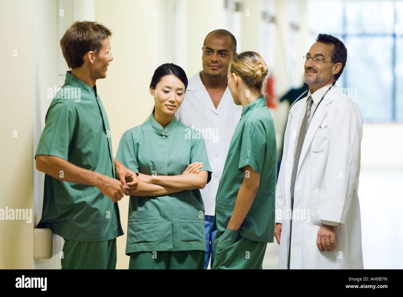 Medical staff chatting in hospital corridor Stock Photo - Alamy
