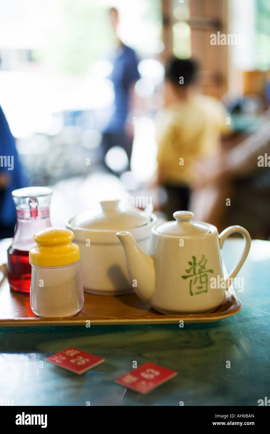 Tray with tea service and table markers on table in restaurant Stock ...