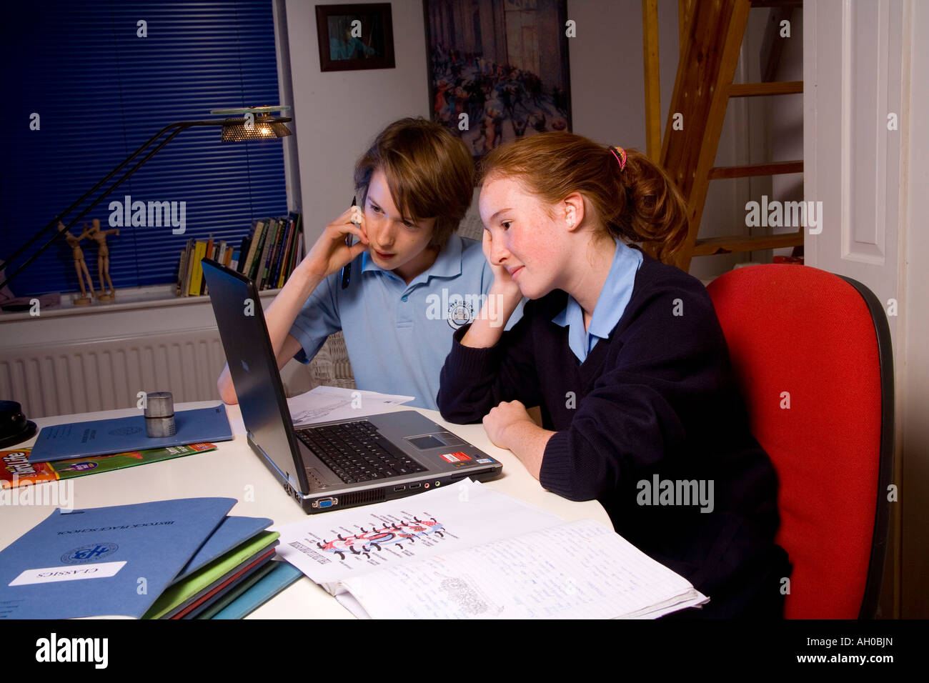 Teenage girl and boy studying and using Laptop Computer Stock Photo - Alamy