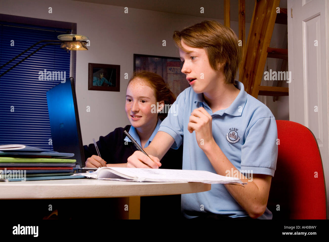 Teenage girl and boy studying and using Laptop Computer Stock Photo - Alamy