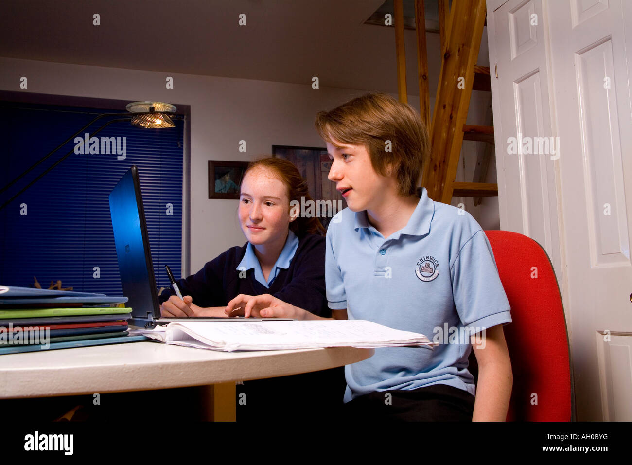 Teenage girl and boy studying and using Laptop Computer Stock Photo - Alamy