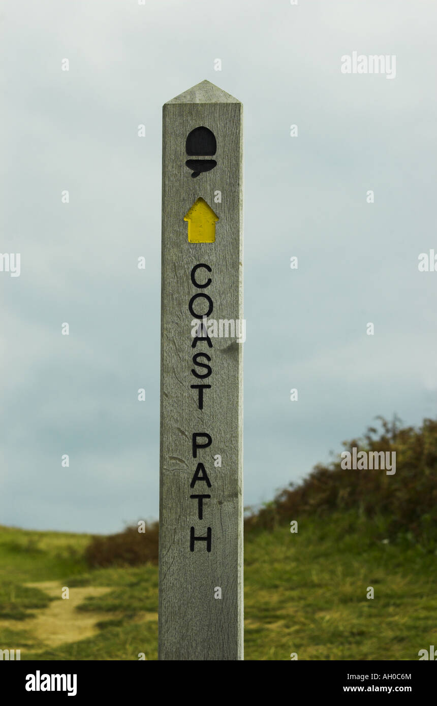 wooden coastal path sign post with yellow arrow and acron logo Stock ...