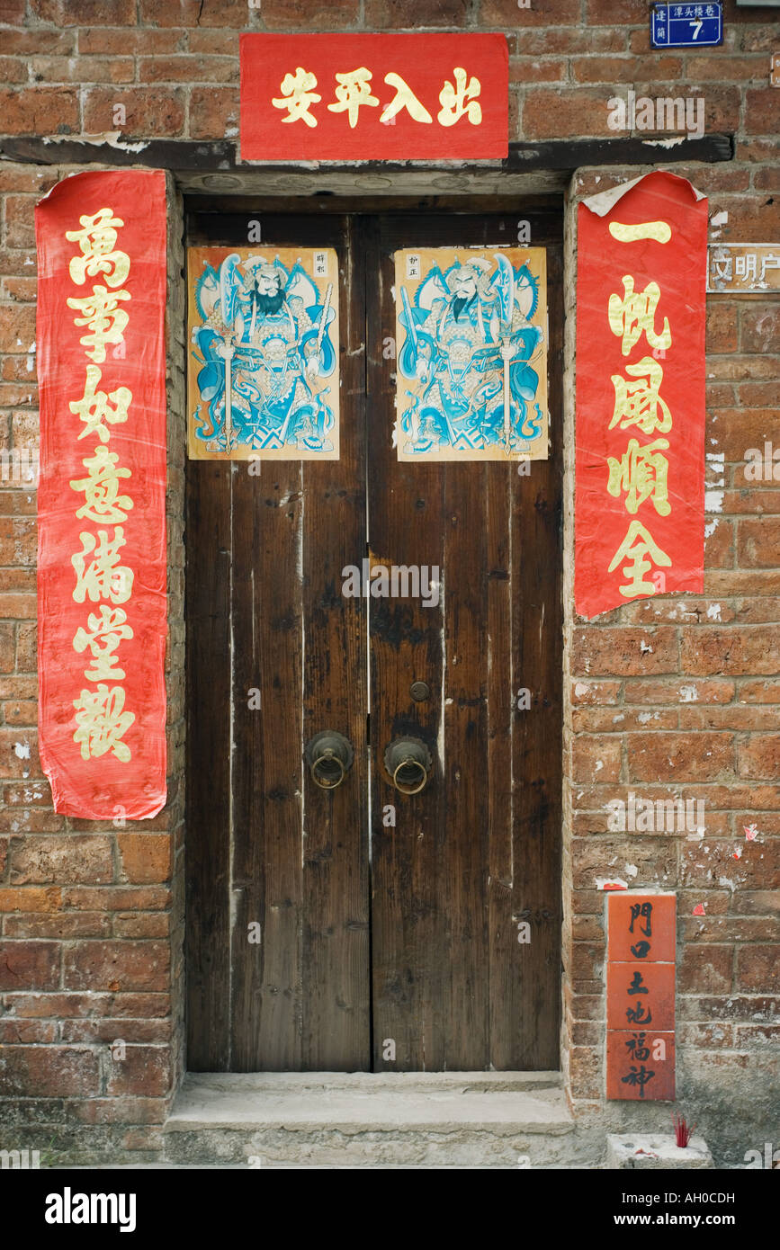 China, doorway surrounded with banners with Chinese proverbs Stock ...