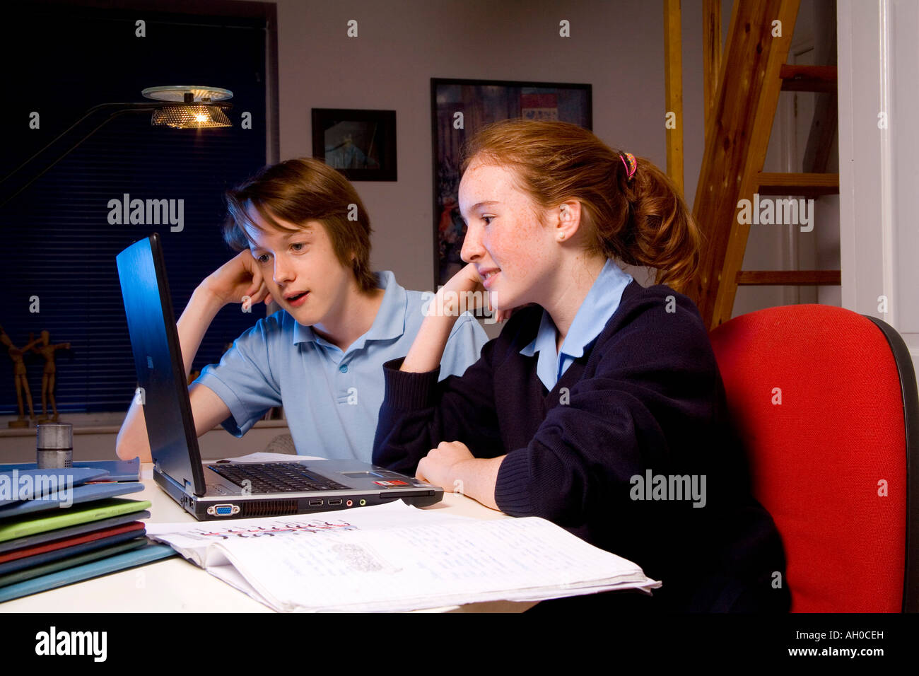 Teenage girl and boy studying and using Laptop Computer Stock Photo - Alamy