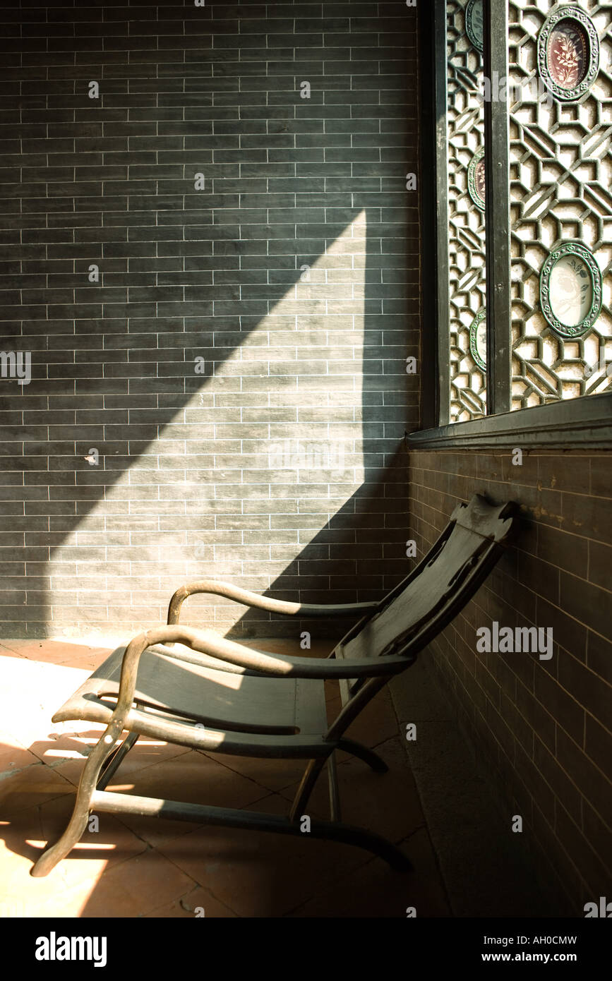 Wooden chair near window, in sun Stock Photo - Alamy