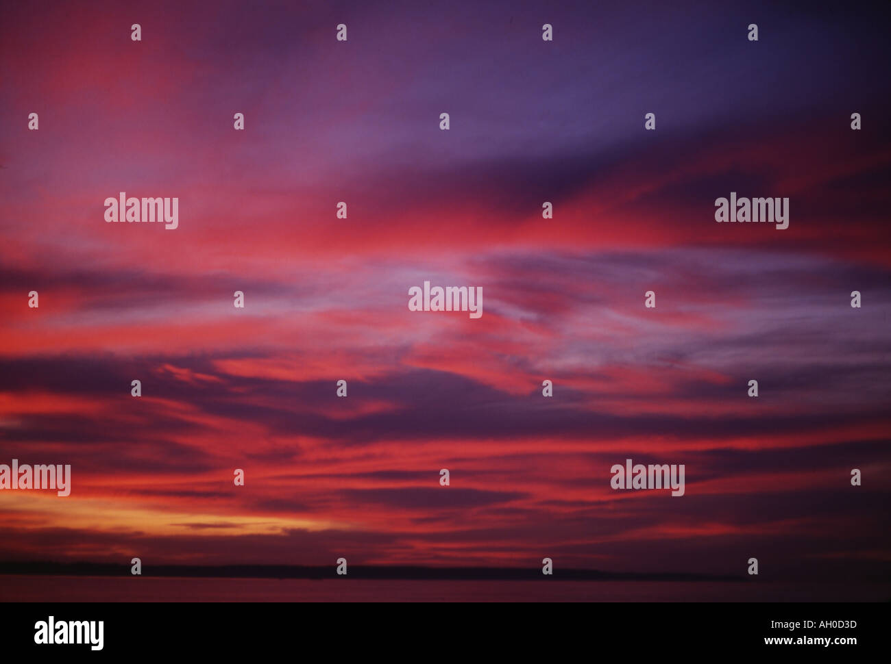 Red and purple sunset sky with cirrus clouds and horizon Stock Photo ...
