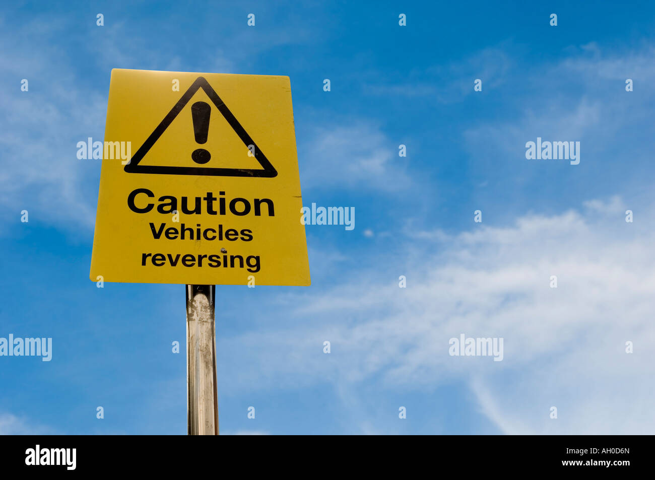 street sign caution vehicles reversing Stock Photo - Alamy