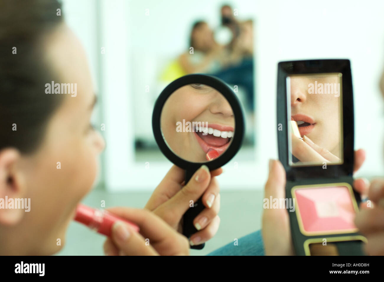 Teen girl smiling at self in mirror hi-res stock photography and images ...