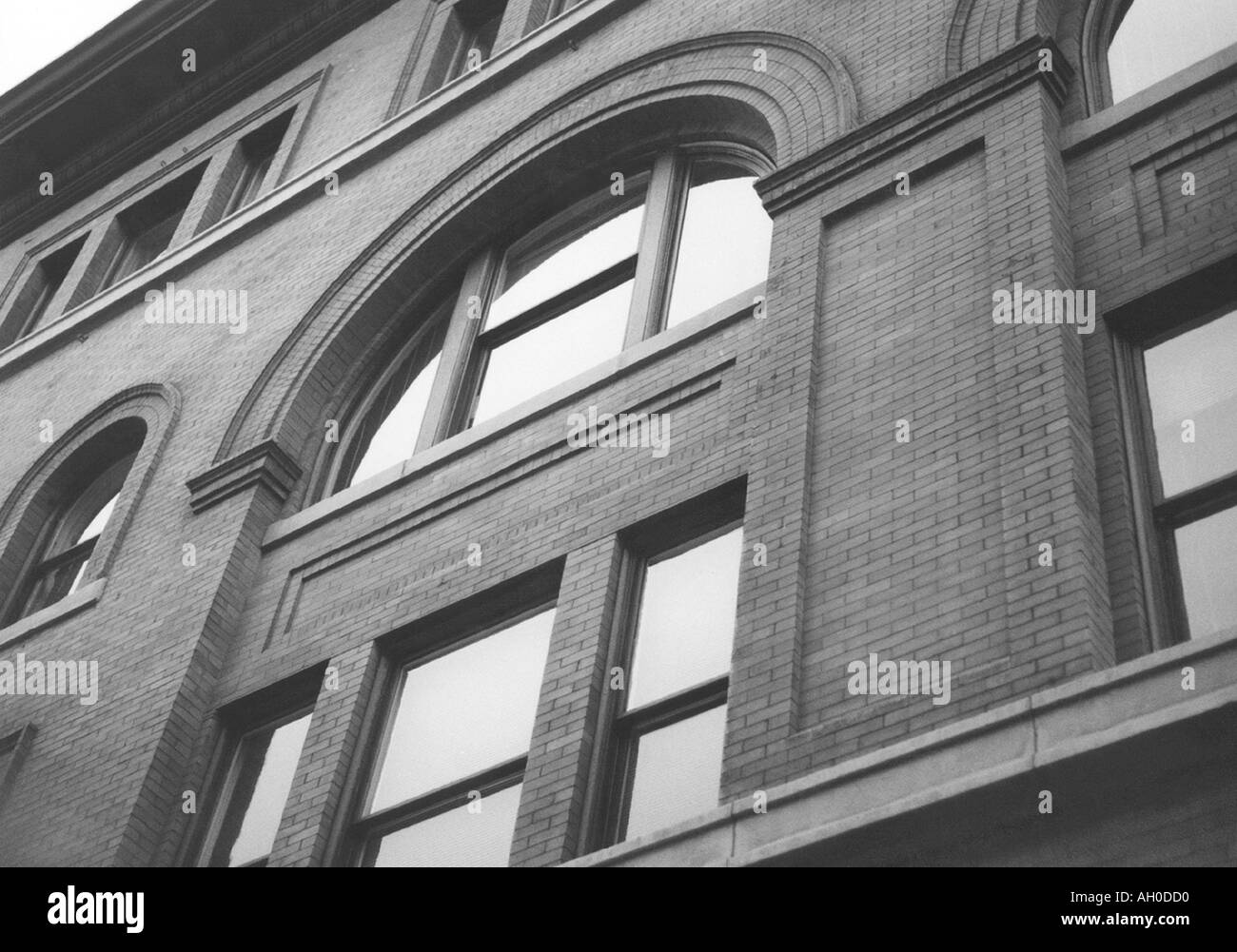 Turn-of-the-century brick building facade with arched windows Stock ...