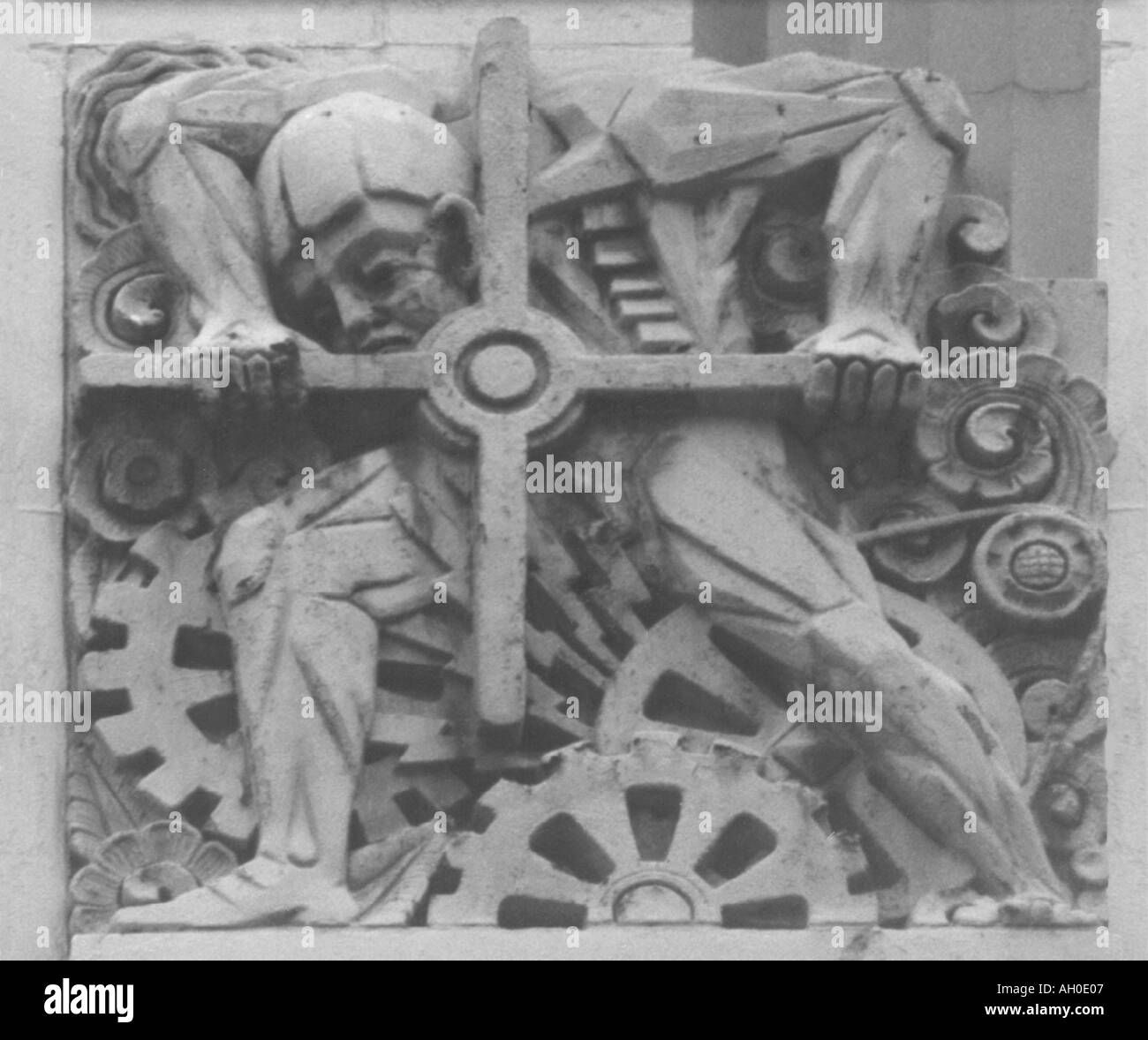 Cranking man stone sculpture from a building in downtown Seattle Stock ...