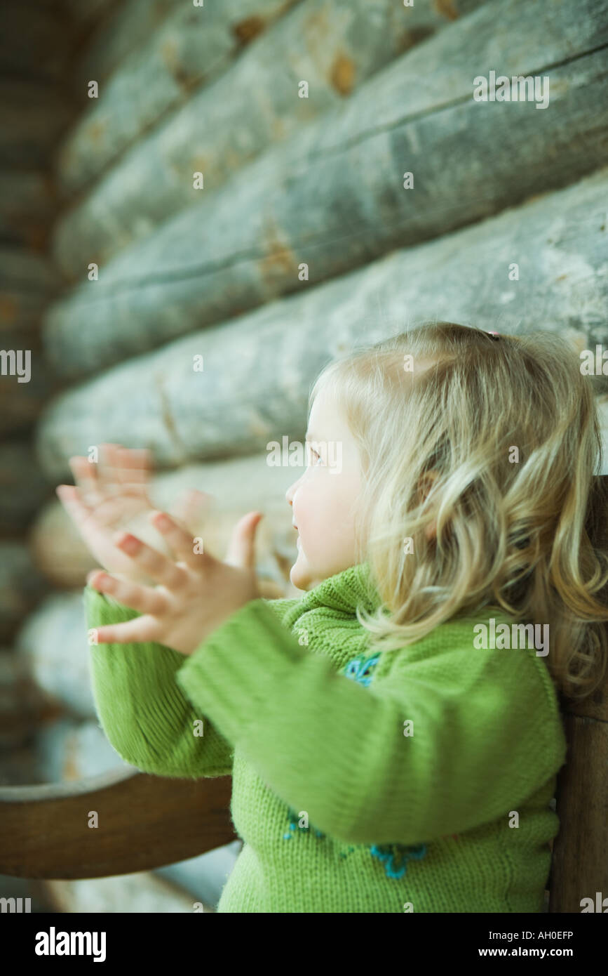 Toddler girl clapping hands, side view, blurred motion Stock Photo - Alamy